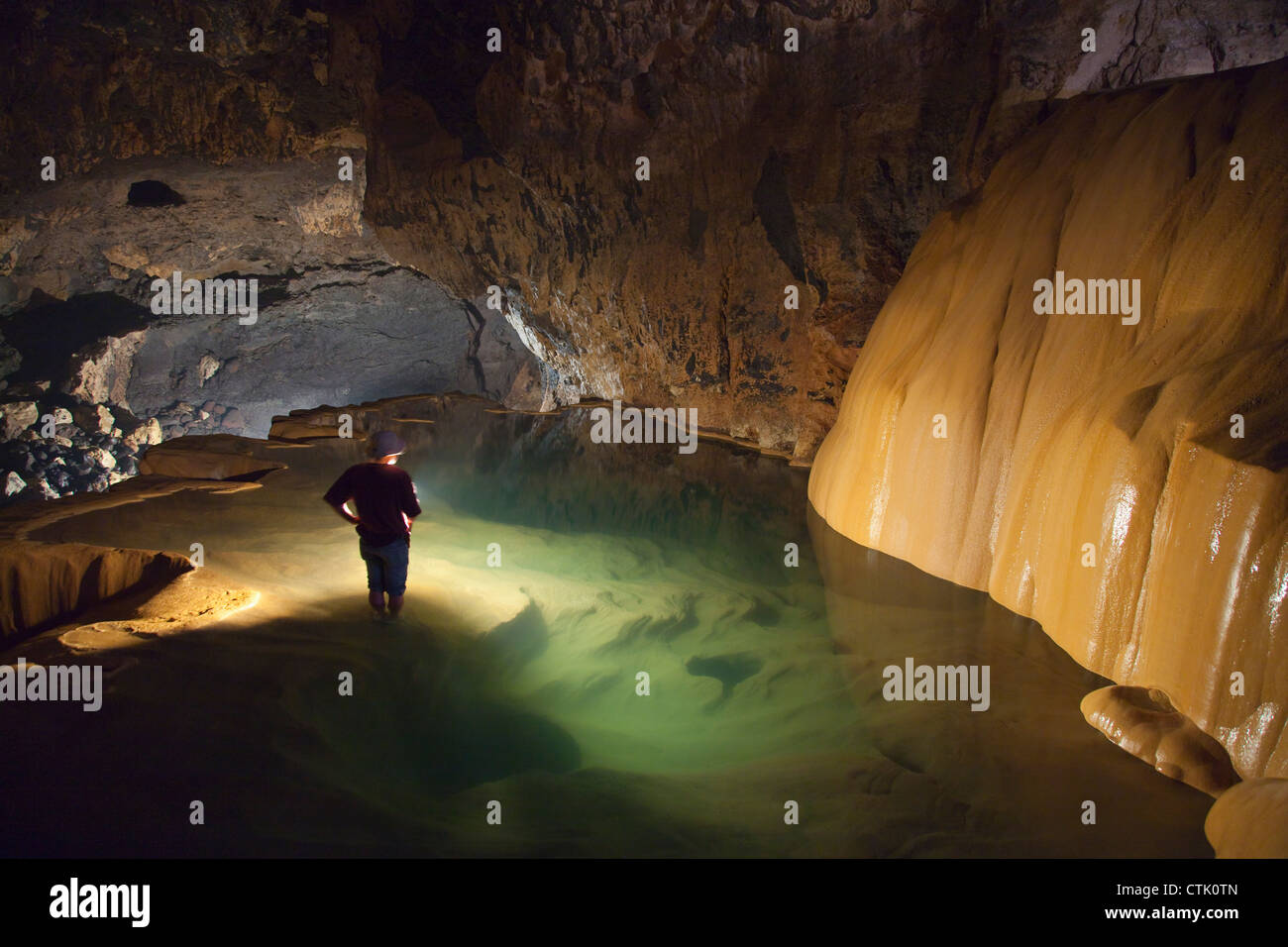 A Filipino Tour Guide Holds A Lantern Inside Sumaging Cave Or Big Cave ...