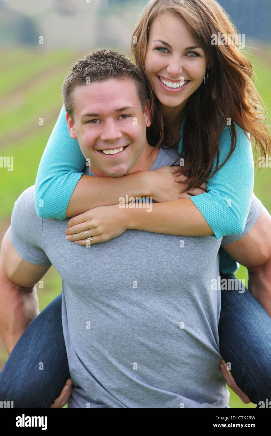 Guy Giving Girl A Piggyback Ride; Troutdale, Oregon, United States of ...