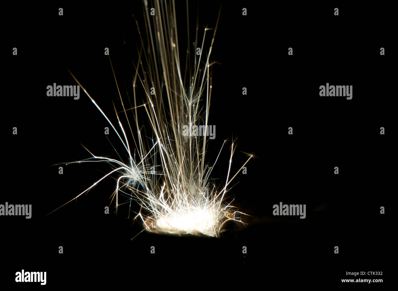 radiative spark from a lighter on the black background Stock Photo - Alamy