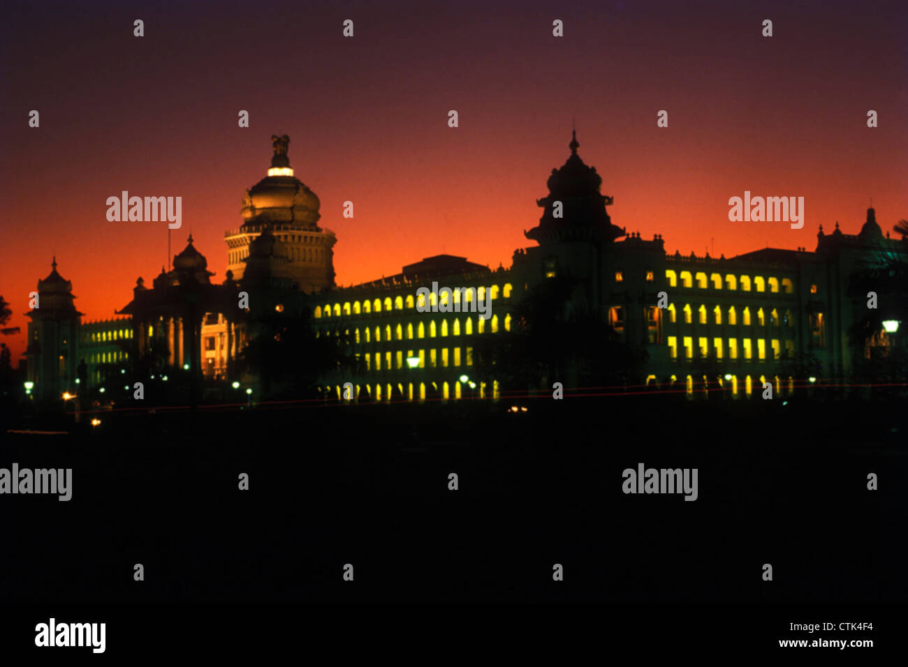 Illuminated building at backdrop of rednessof sunset Stock Photo - Alamy