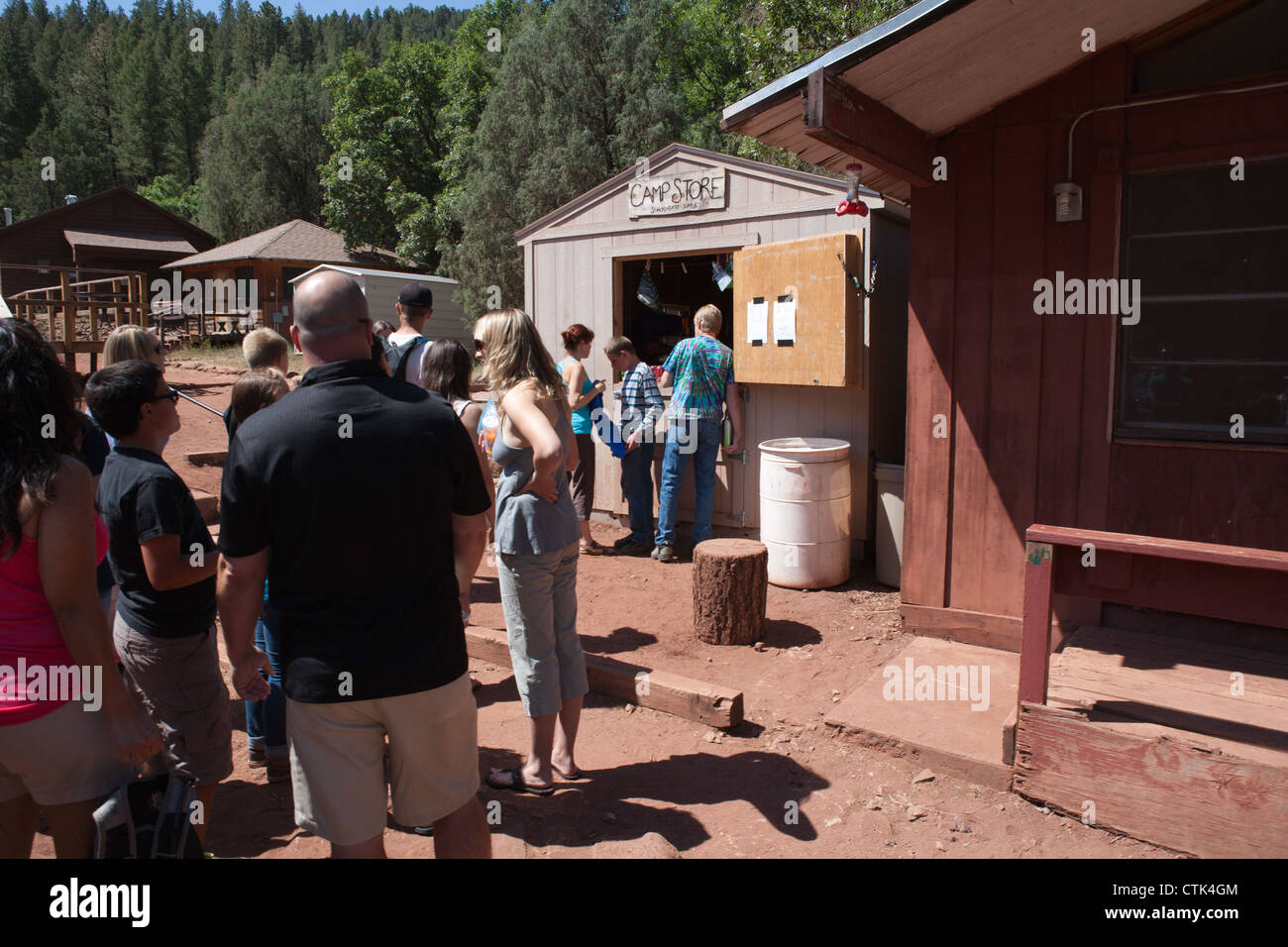 People waiting in line at summer camp store Stock Photo - Alamy