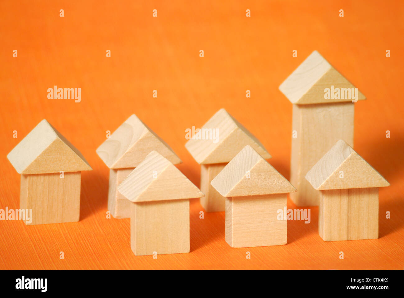 Arrangement of simple wooden blocks represents housing or neighborhood ...
