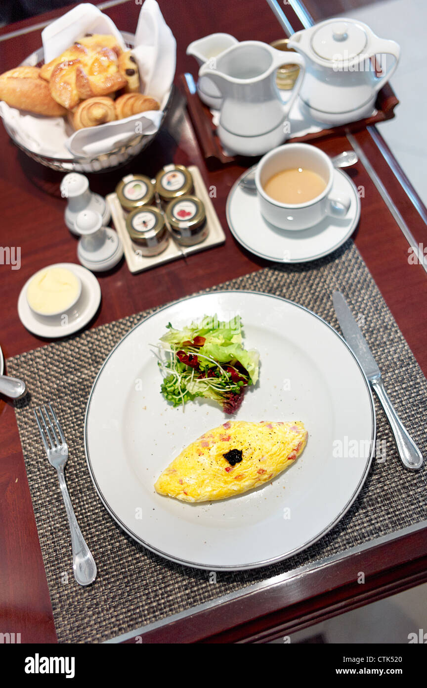 A complimentary Western styled breakfast consisting of a omelet, small ...