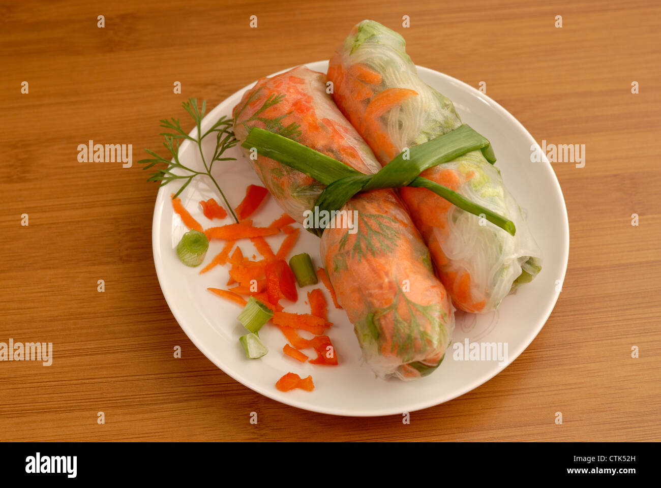 Vietnamese style Spring Rolls, garnished and tied together with a green ...