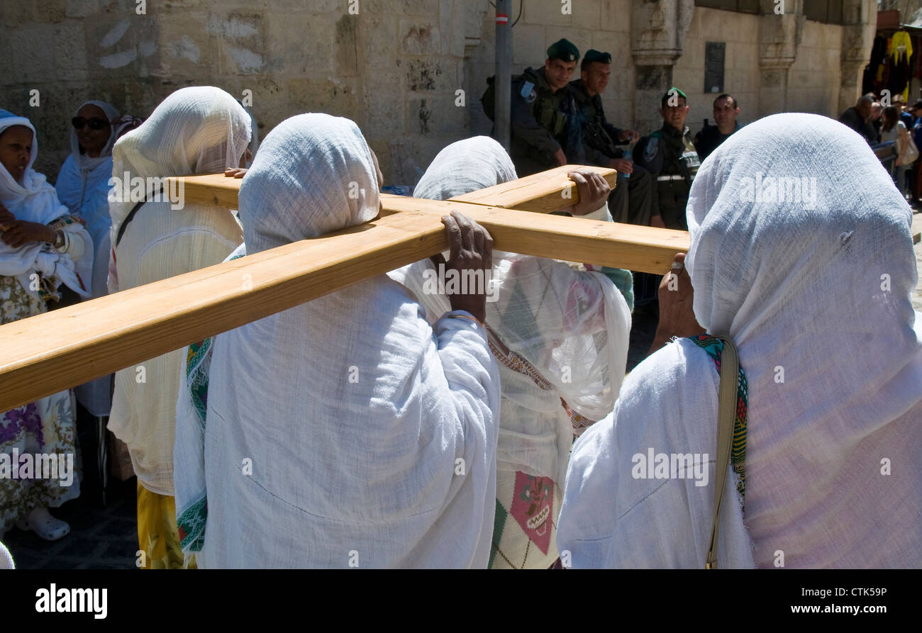Ethiopian Christian pilgrims carry across along the Via Dolorosa in ...