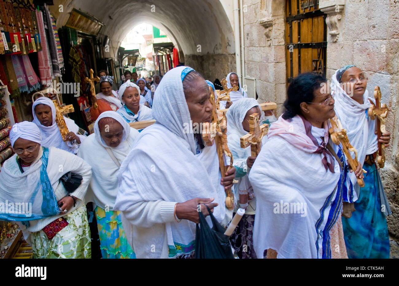 Ethiopian Christian pilgrims carry across along the Via Dolorosa in ...