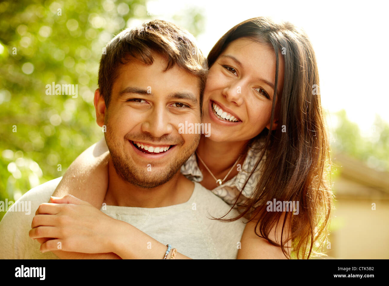 Portrait of a happy couple laughing at camera Stock Photo - Alamy