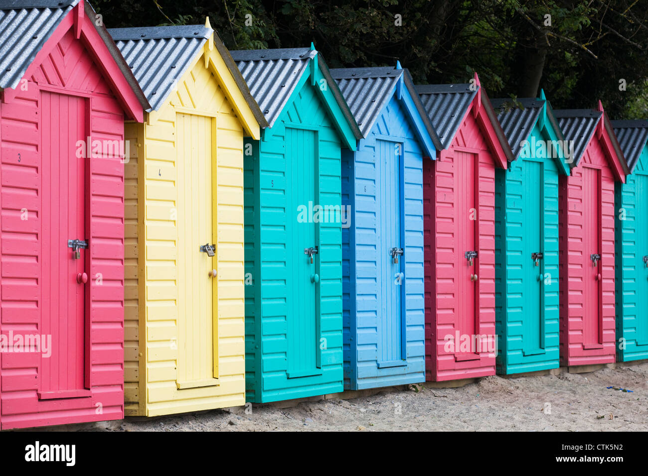 Colourful beach huts at a traditional British Beach Stock Photo - Alamy