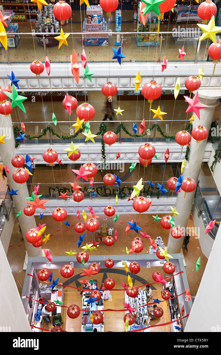 Festive star shaped and traditional Chinese lanterns hanging in a ...