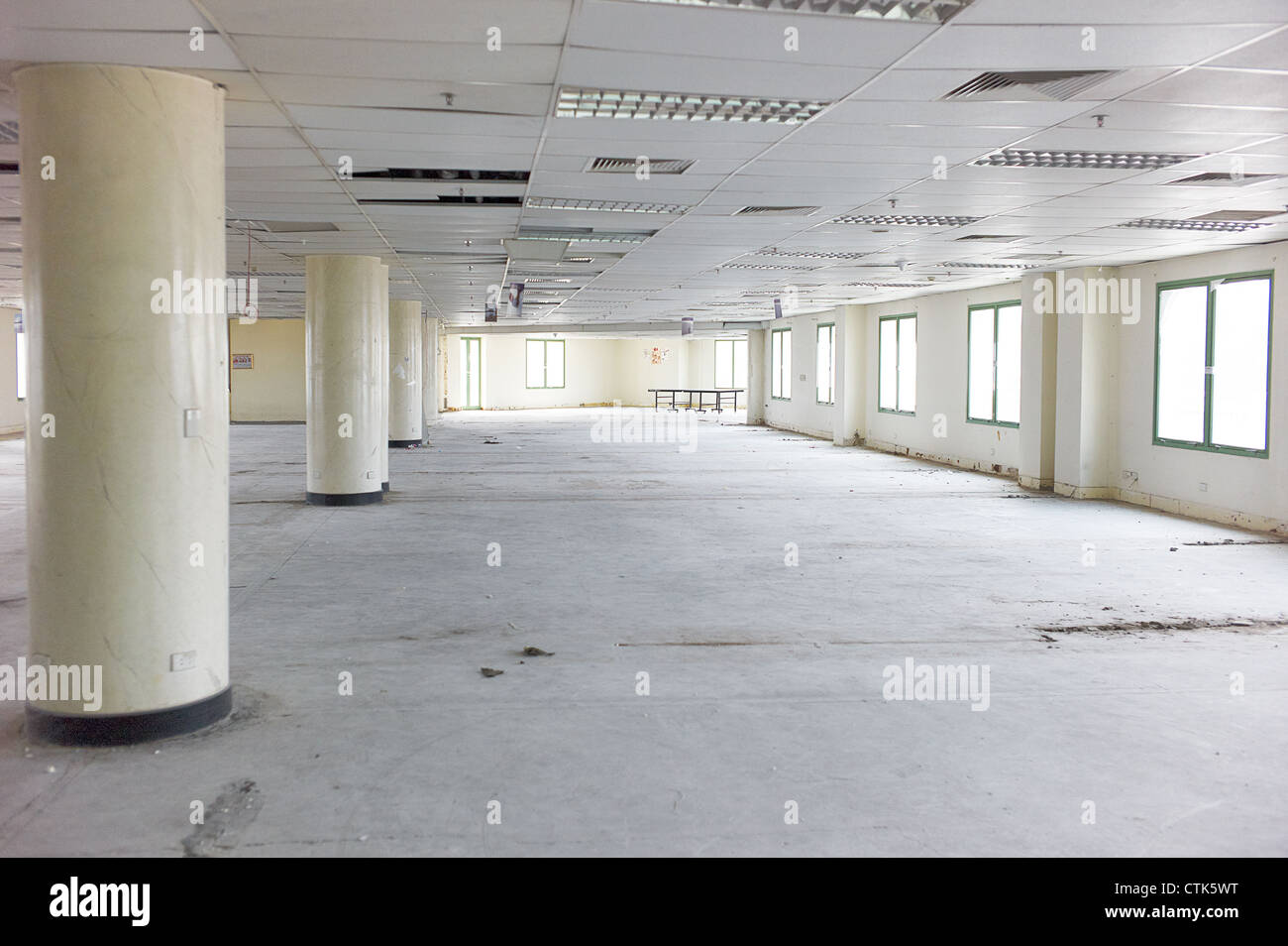 An empty abandoned office building floor Stock Photo - Alamy