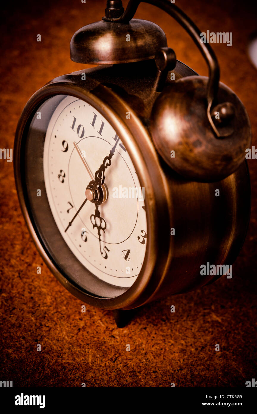 classic alarm clock set at five o'clock Stock Photo - Alamy