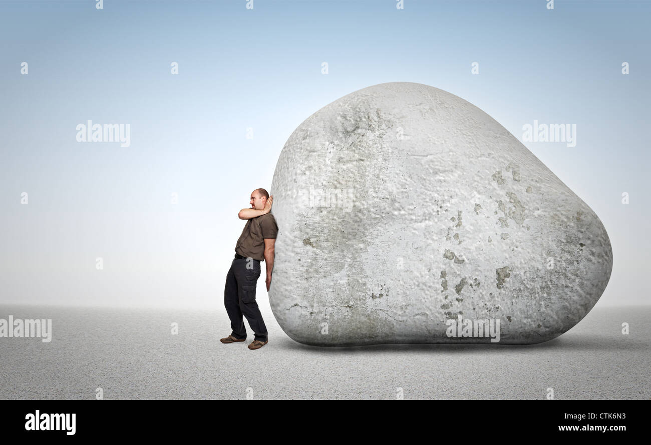man try to move an huge stone Stock Photo - Alamy