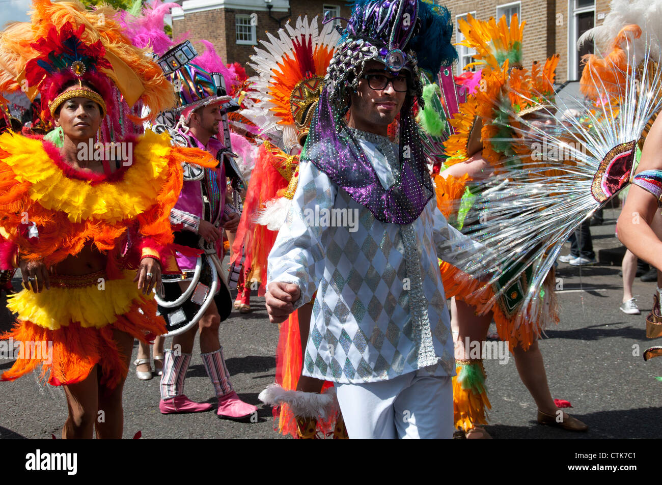 Hackney carnival parade .Dancers walk and dance through the streets ...