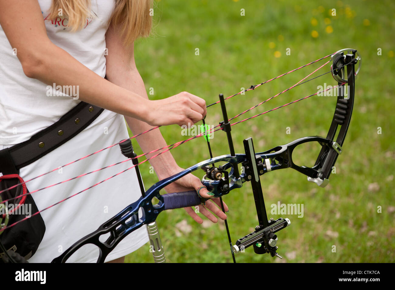 Young female archer practicing archery hi-res stock photography and ...