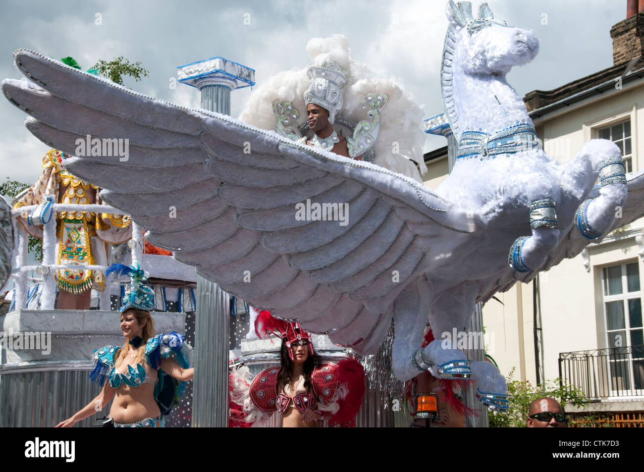Hackney carnival parade . Float with dancers and flying horse, Pegasus ...