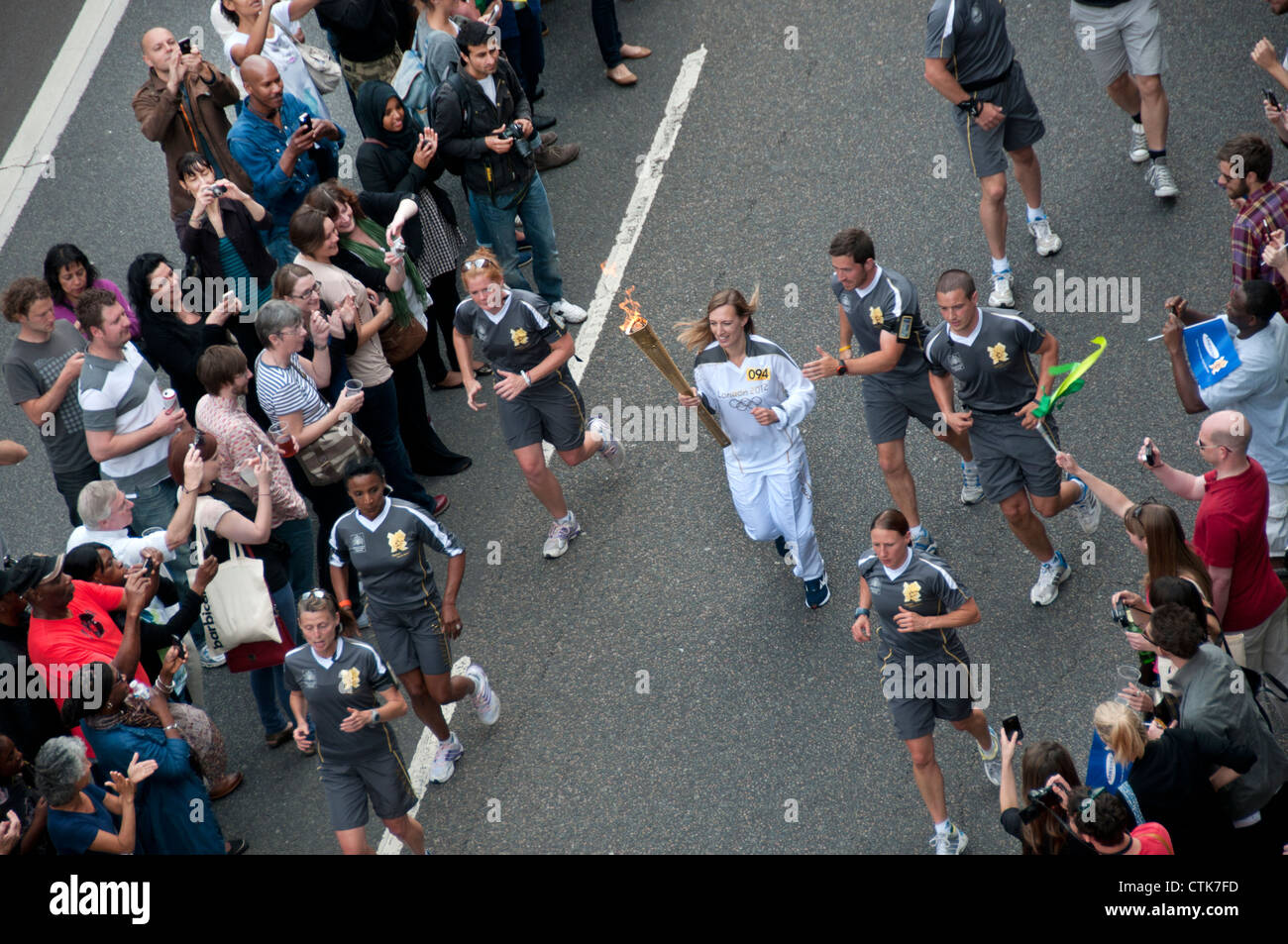 Running with the olympic torch hi-res stock photography and images - Alamy