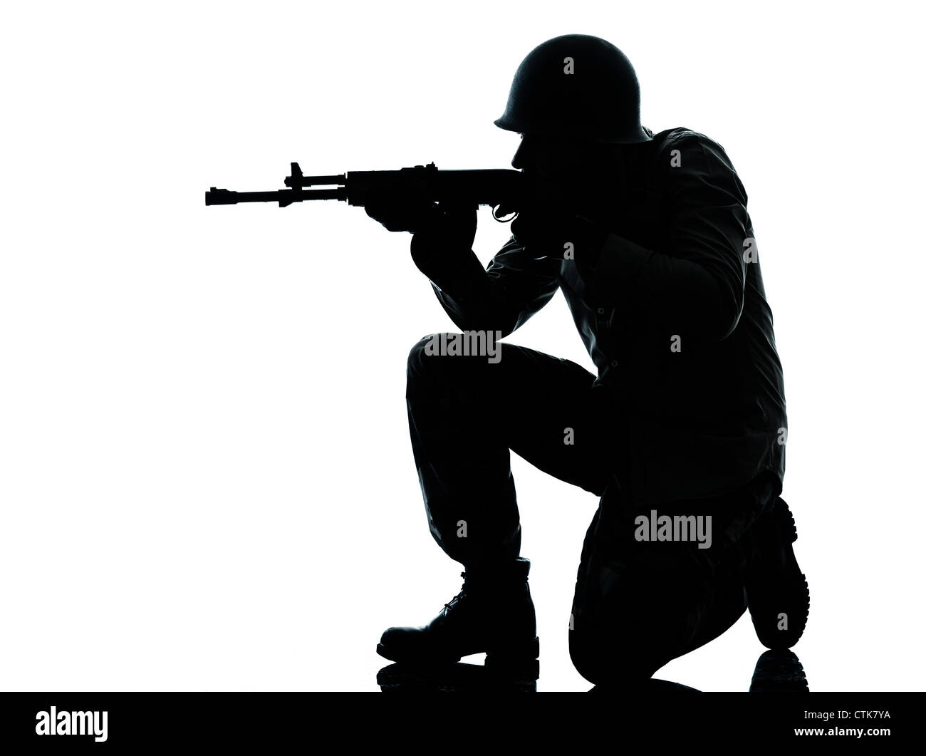 one caucasian army soldier man shooting on studio isolated on white ...