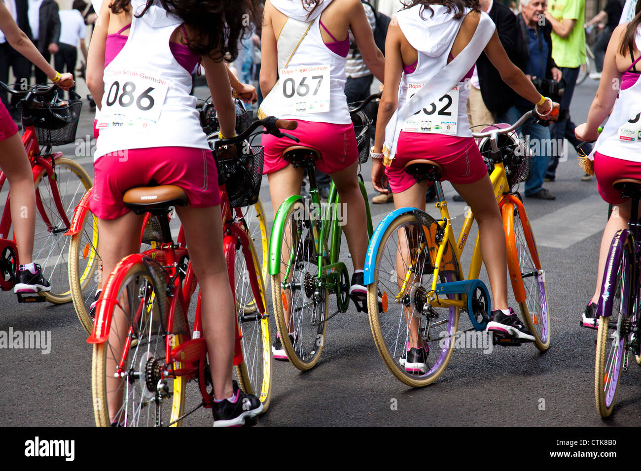 Girls riding colourful bikes in Paris Stock Photo - Alamy