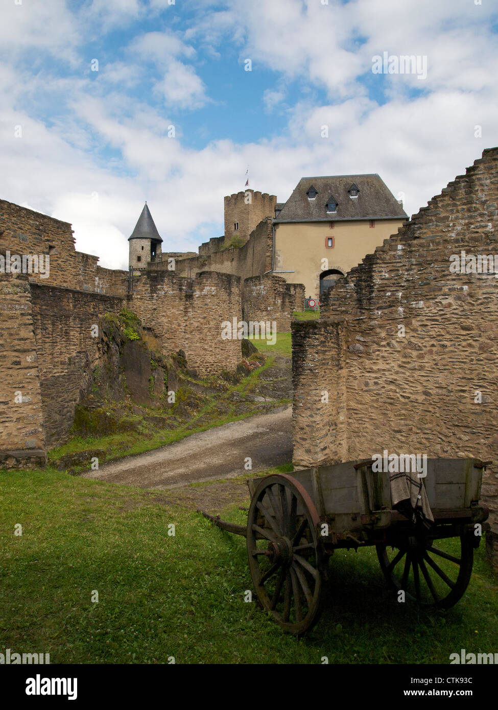 Bourscheid castle in Luxemburg. vertical image with wooden cart in ...