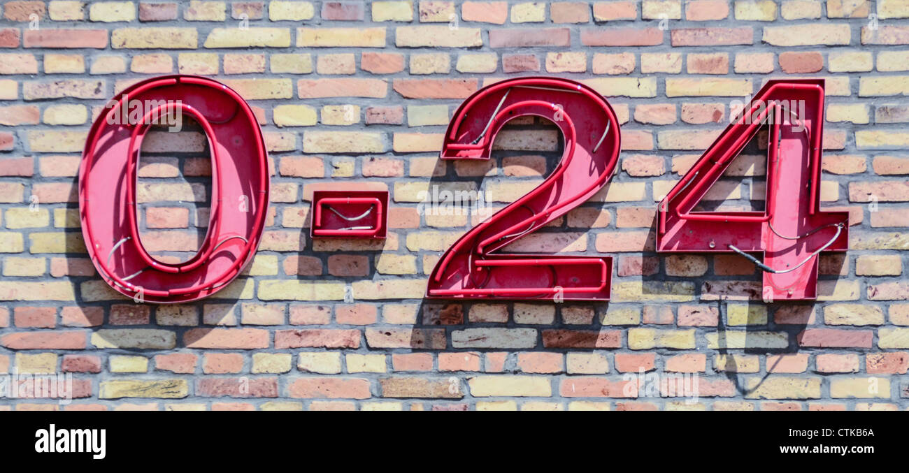 Neon sign 24 hours Stock Photo - Alamy