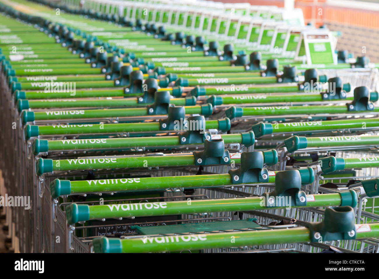 rows of waitrose supermarket trollys Stock Photo - Alamy