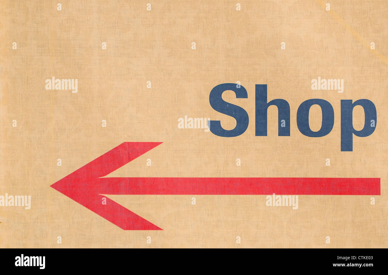 Shop sign with arrow on canvas background Stock Photo - Alamy