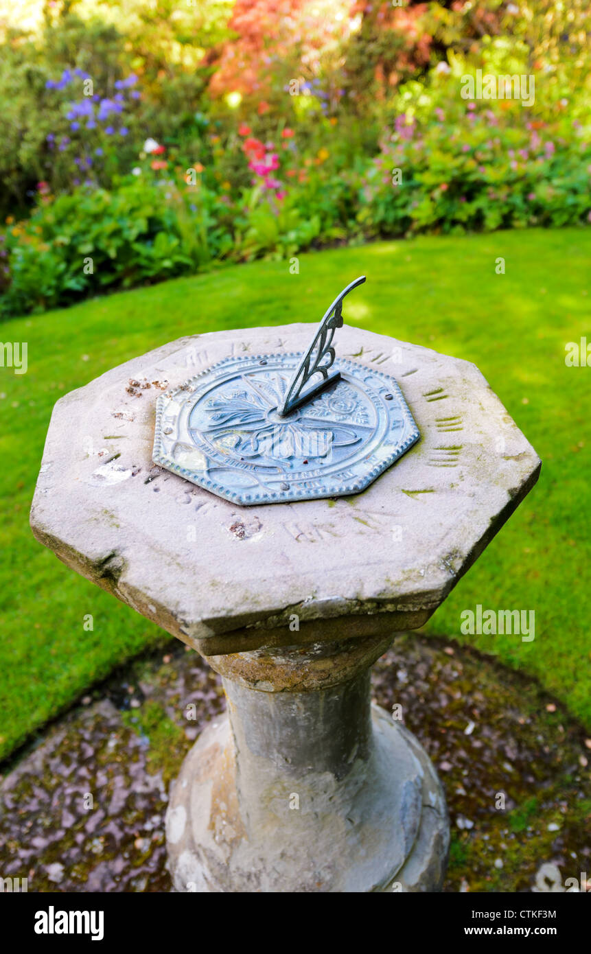 Close up of an octagon sundial in an English country garden Stock Photo ...