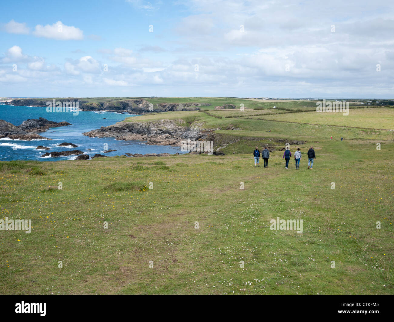 People walking on the North Cornwall coastal path near Bedruthan Steps ...