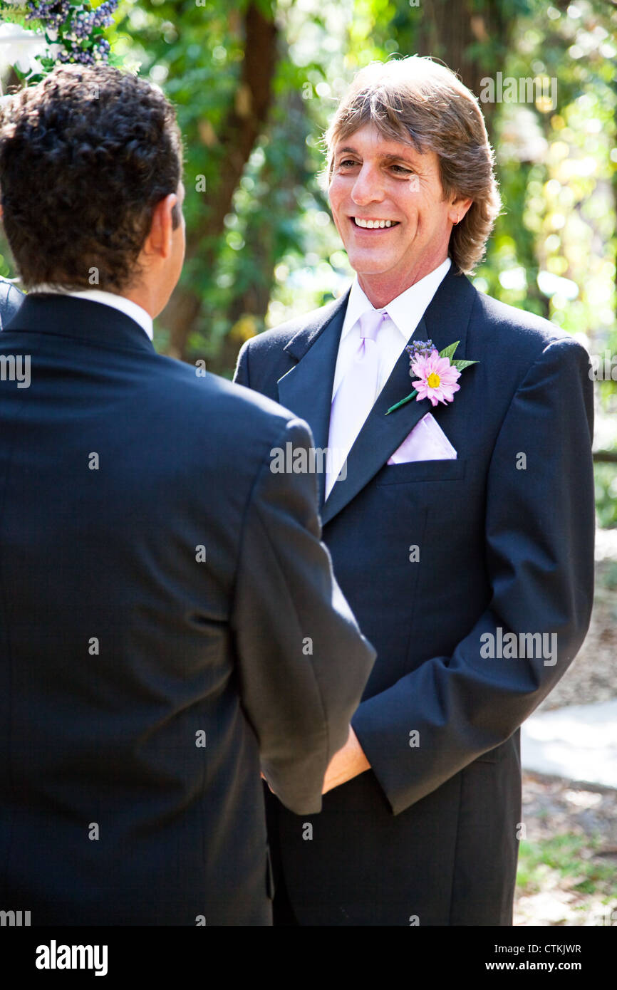Handsome groom marries his life partner in an outdoor wedding ceremony ...