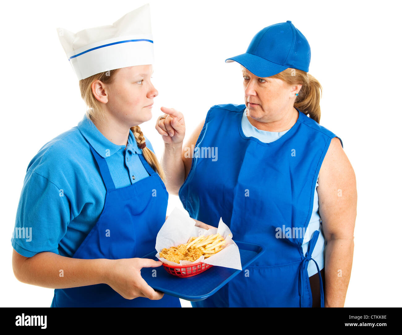 Teen girl working in fast food gets pushed around by her boss. Isolated ...
