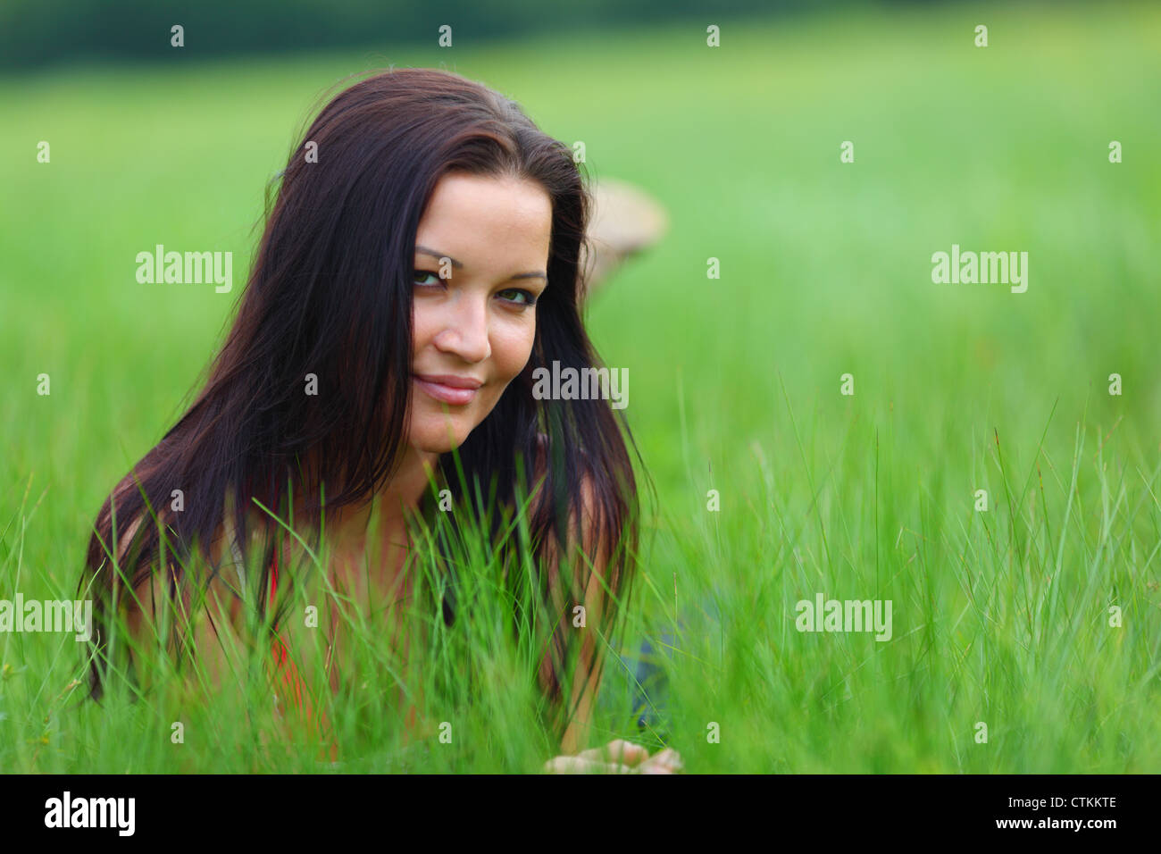 woman on grass in green fields Stock Photo - Alamy