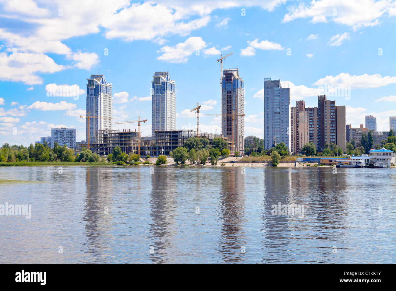 modern houses on river bank in summer day Stock Photo - Alamy