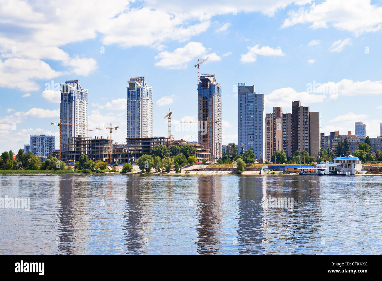 modern houses on river bank in summer day Stock Photo - Alamy