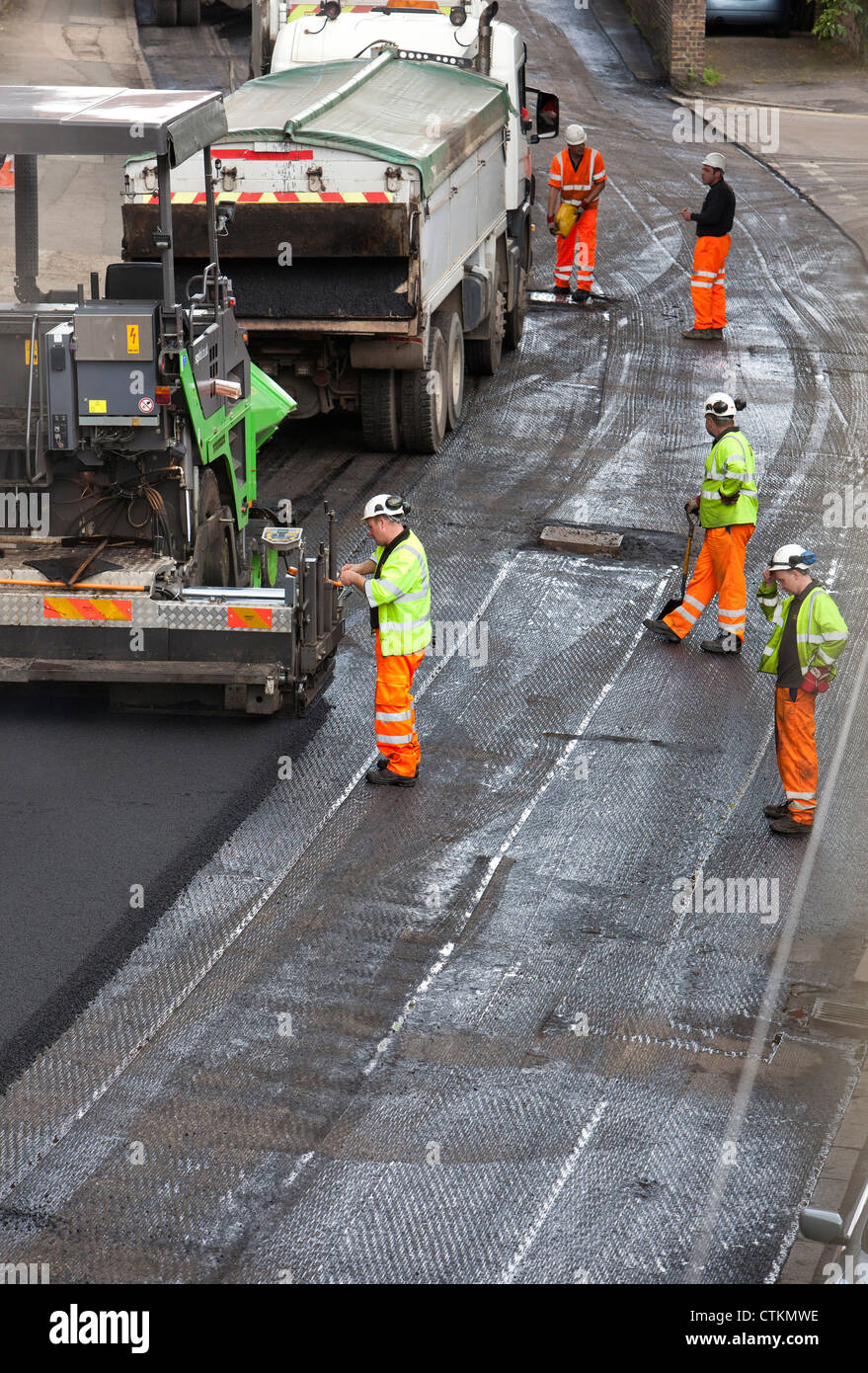Road being resurfaced with new layer of tarmac asphalt Stock Photo - Alamy
