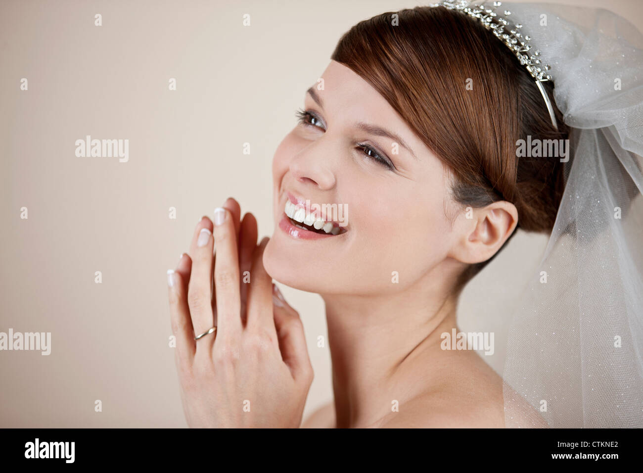 A young bride smiling, side view Stock Photo - Alamy