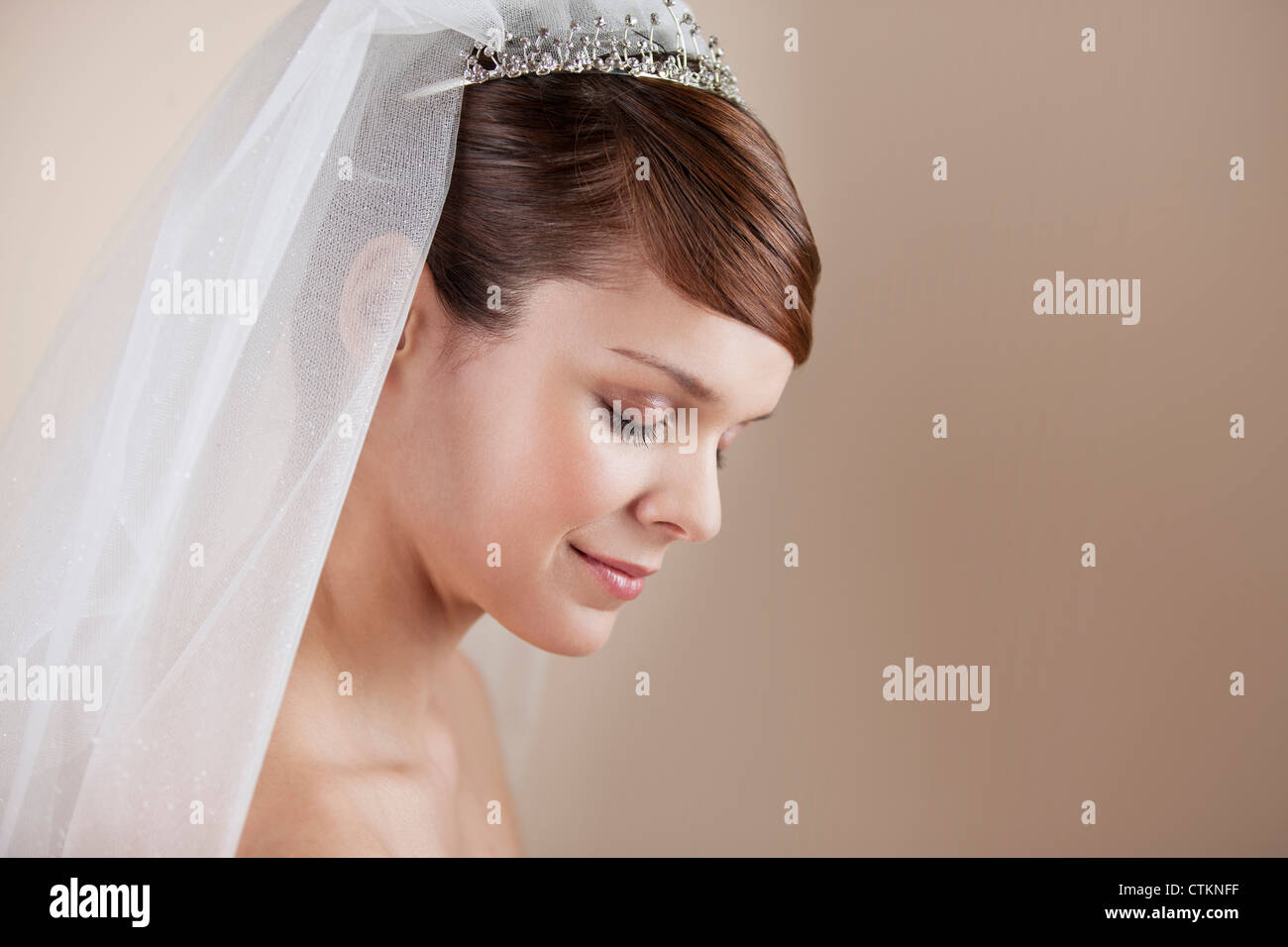 A young bride with her eyes closed, side view Stock Photo - Alamy