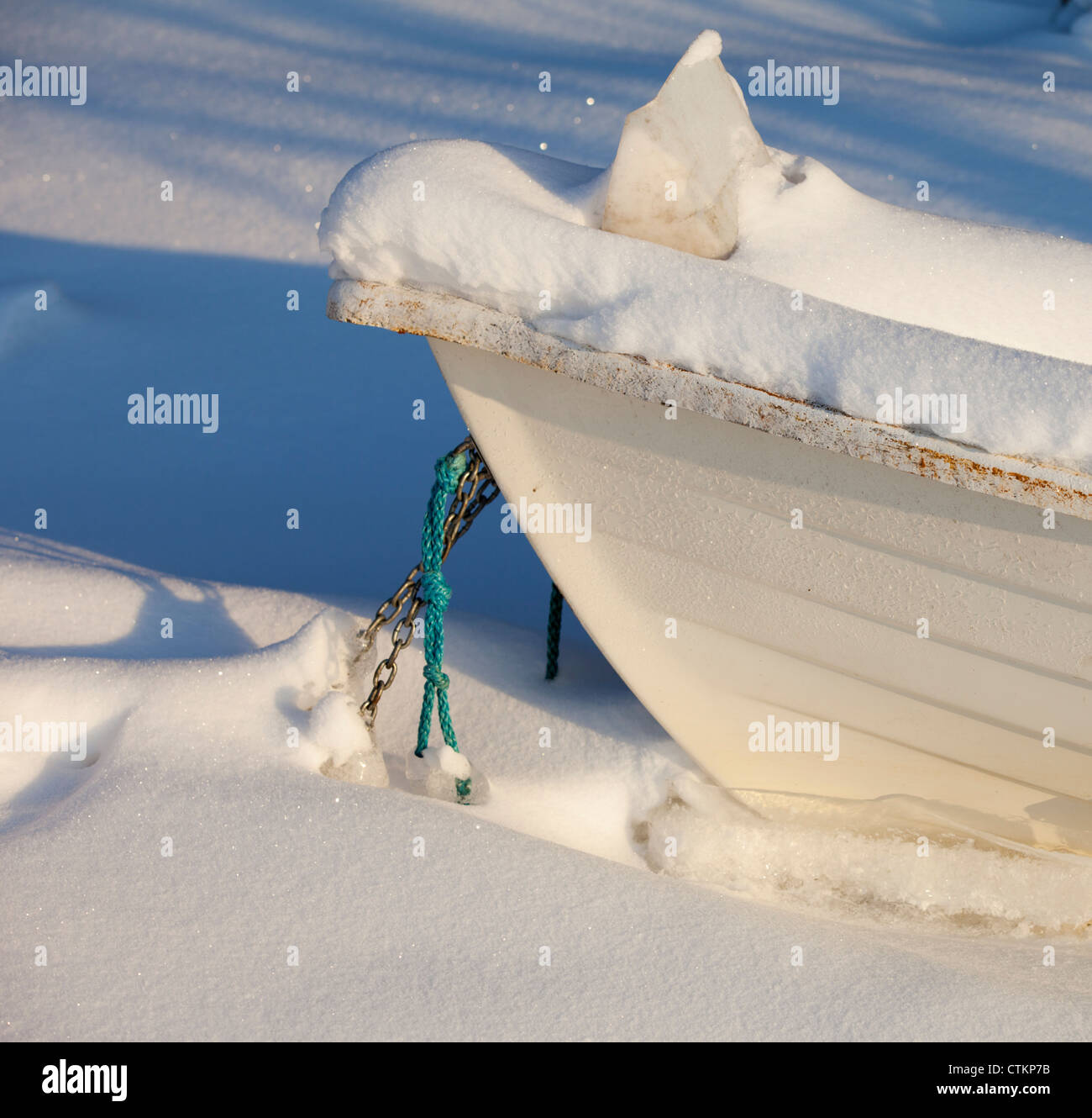 Rowboat / skiff bow and mooring chains at snow at Winter , Finland ...