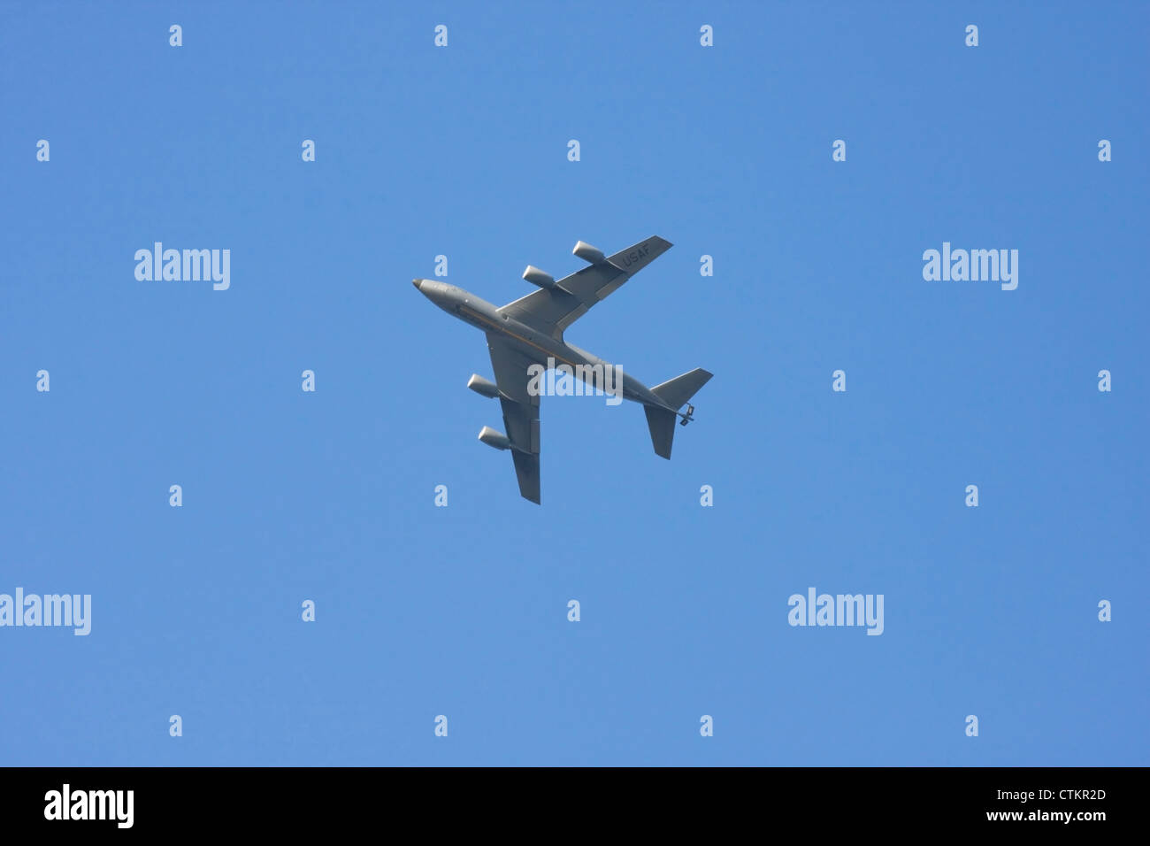 Navy tanker airplane flying in blue sky Stock Photo - Alamy