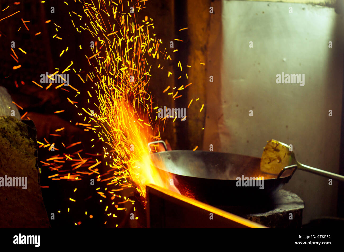 wok cooking in asian style, common scene at the street in asian ...