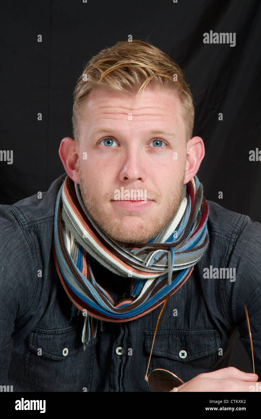 Young man with scarf, showing different expressions Stock Photo - Alamy
