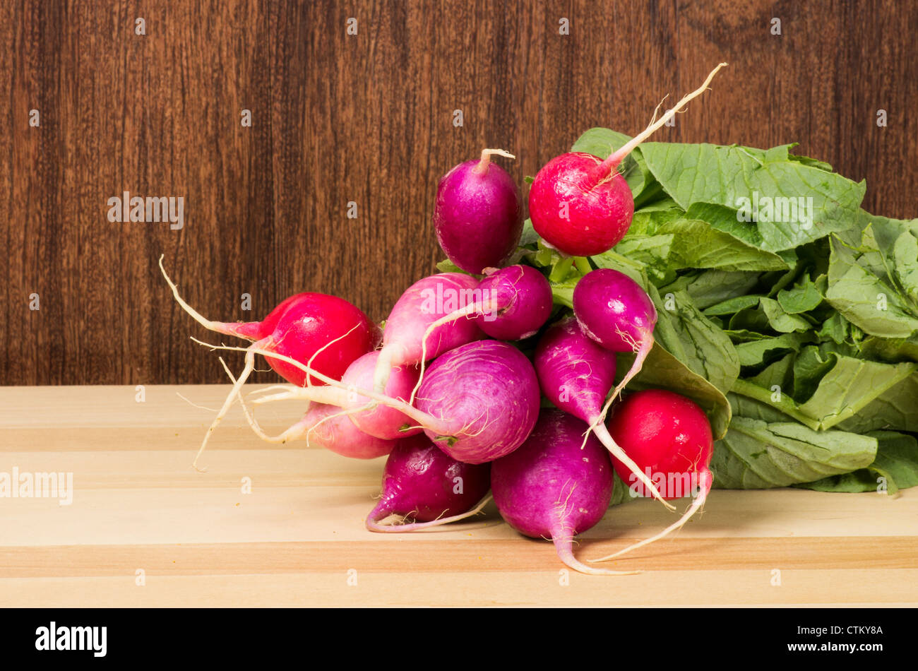 Bunch of colored red and pink radishes in the kitchen Stock Photo - Alamy