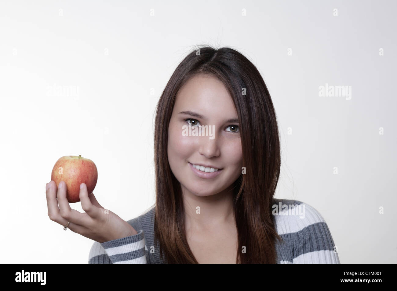 young happy woman eating a nice apple Stock Photo - Alamy