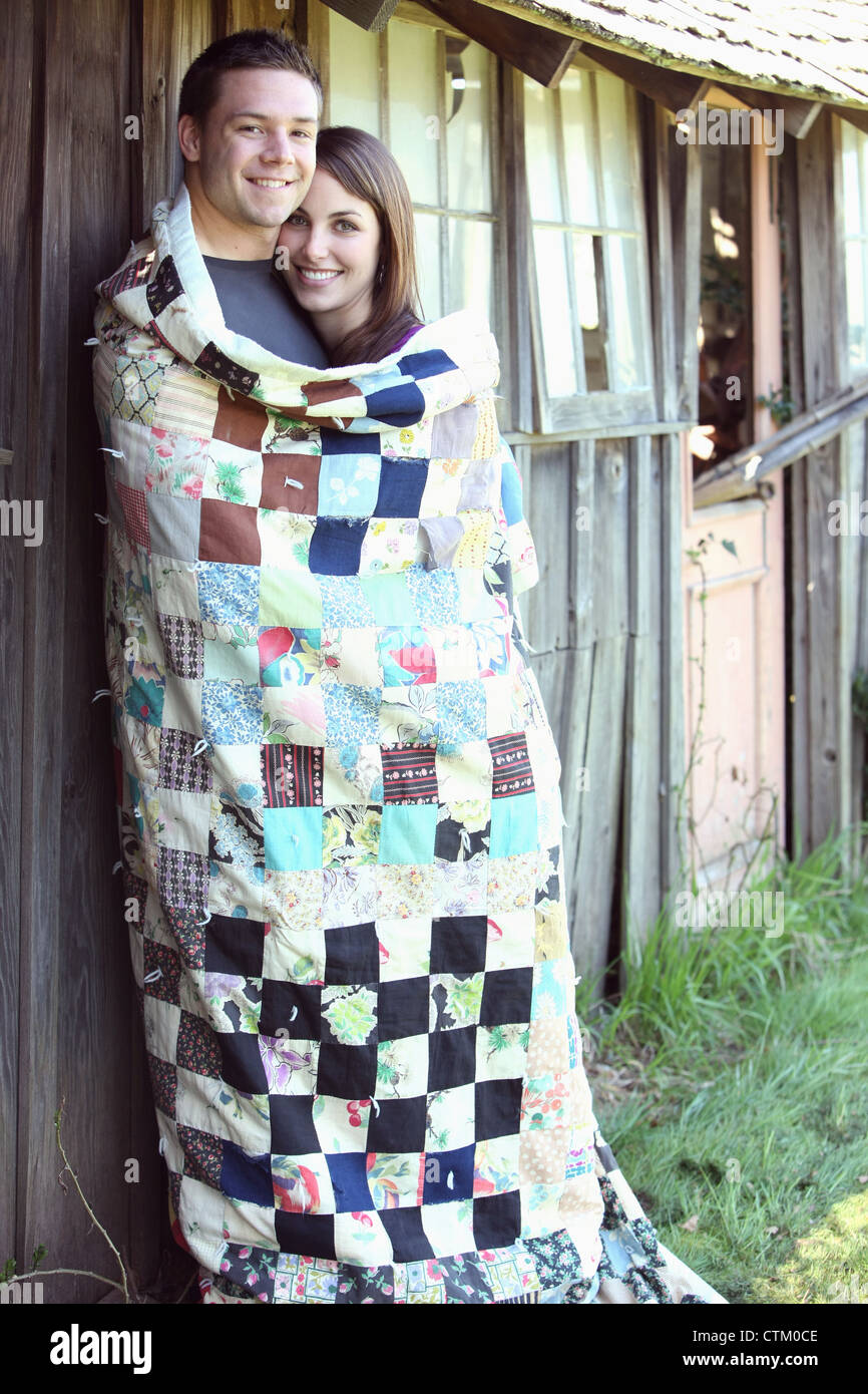 A Young Man And Young Woman Wrapped Together In A Blanket; Troutdale ...