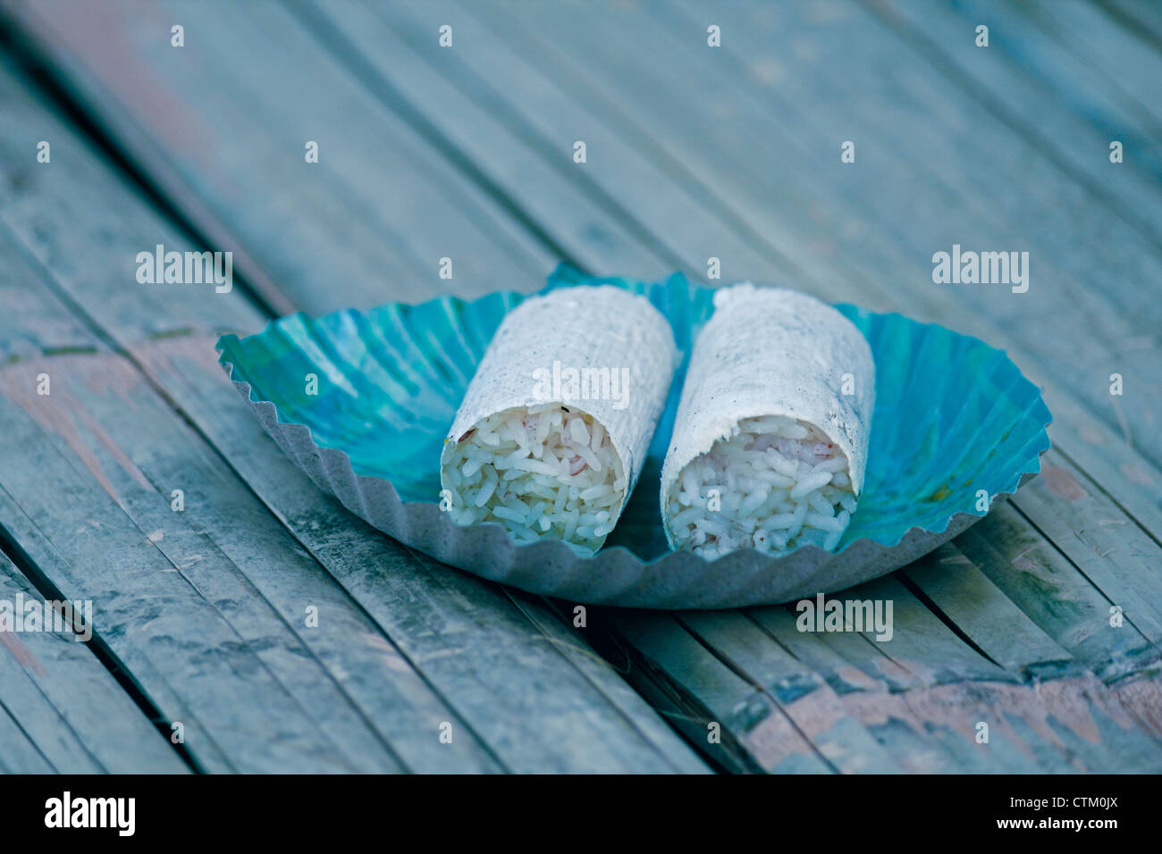 Rice steamed in bamboo tube served in a paper dish, Miao, arunachal ...