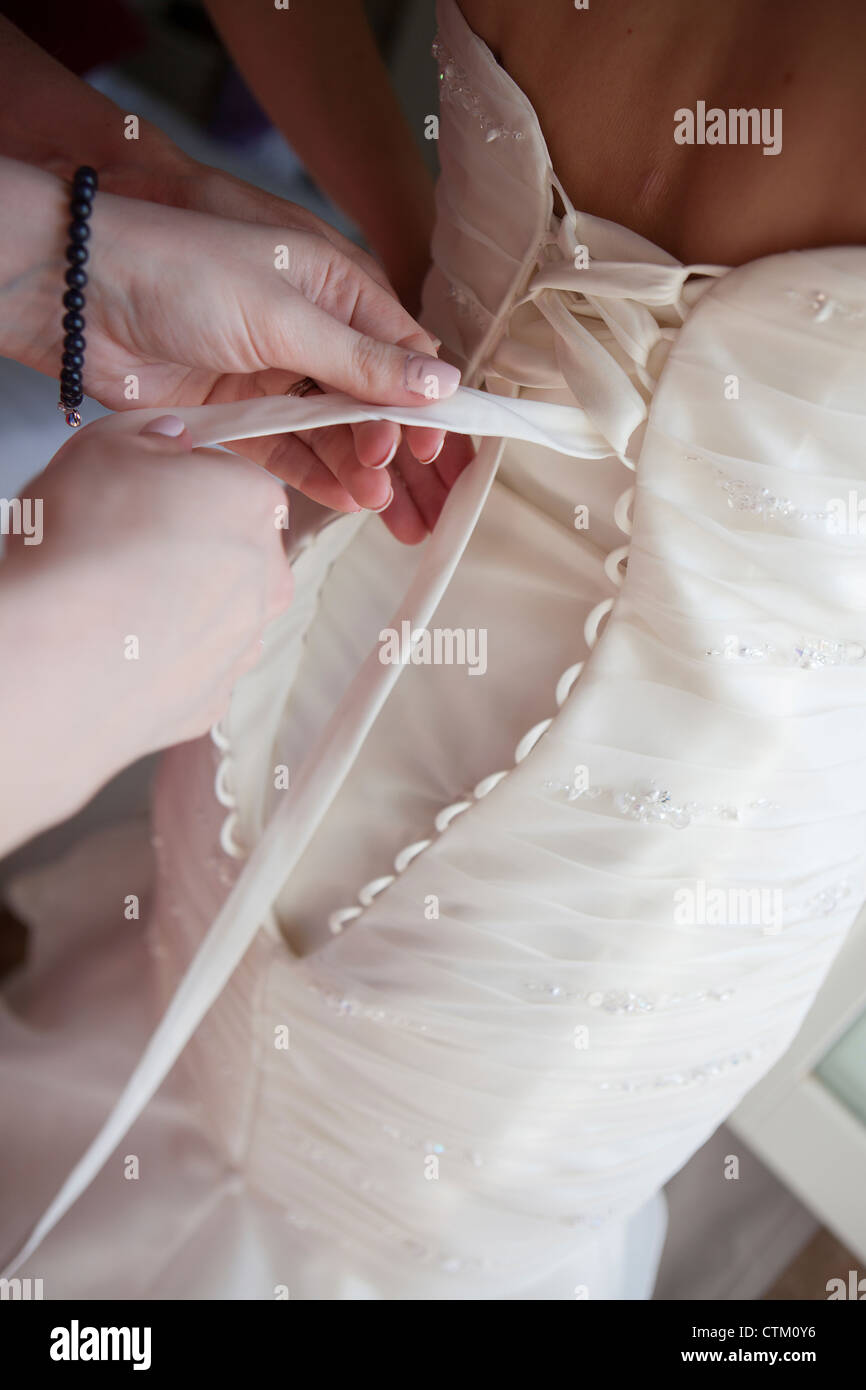 back of a bride, getting dressed Stock Photo - Alamy