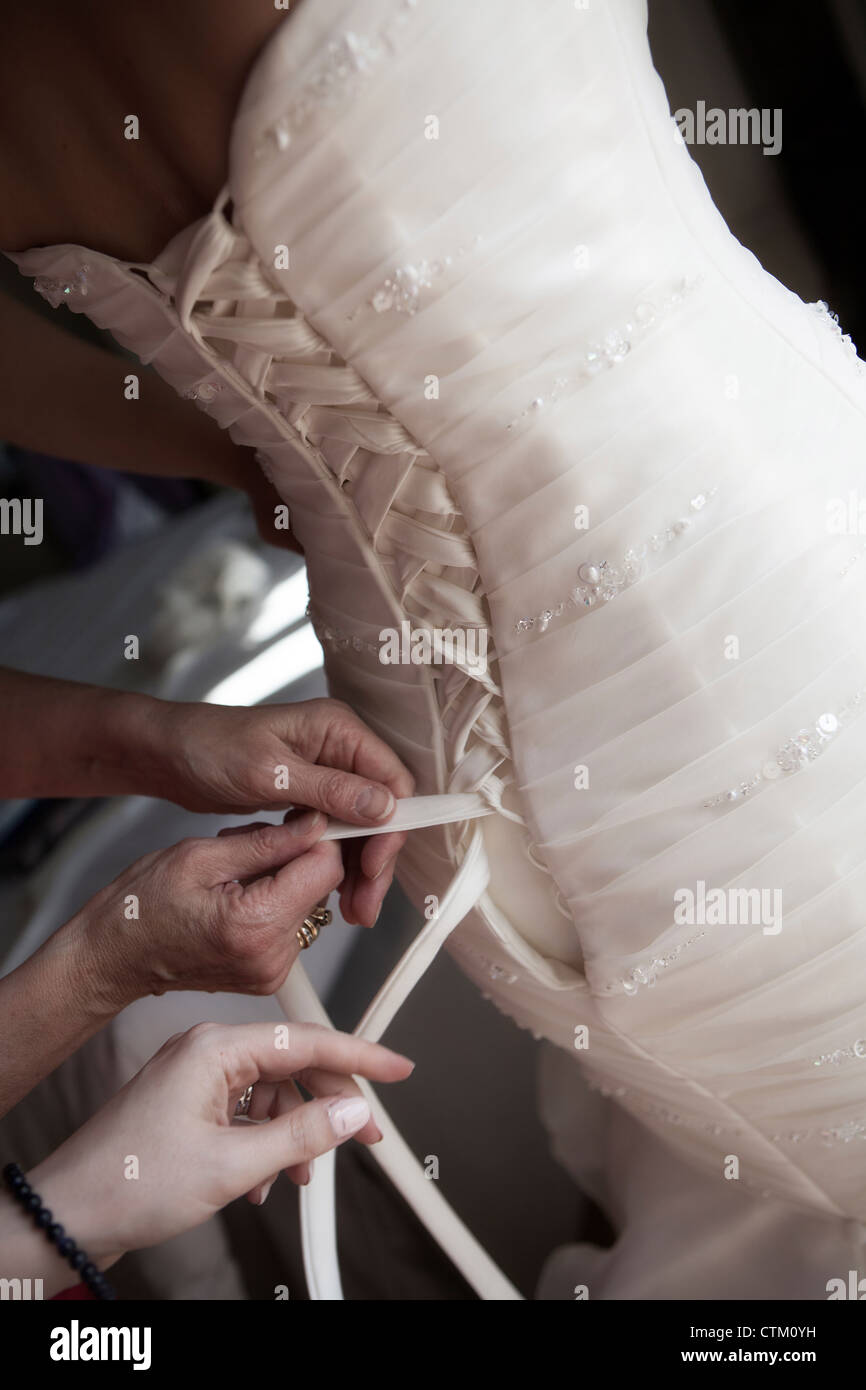 back of a bride, getting dressed Stock Photo - Alamy