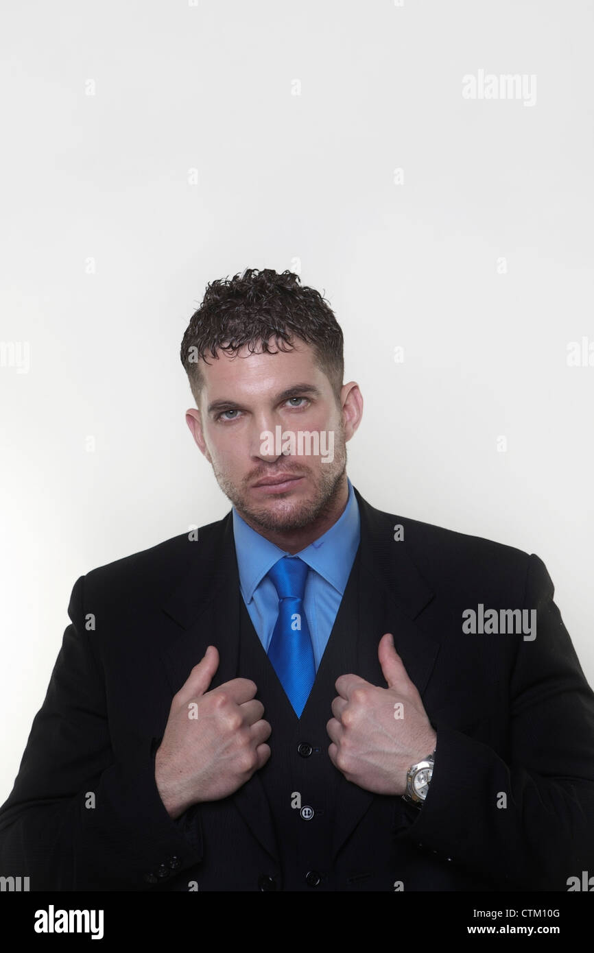 handsome business man standing poses looking around Stock Photo - Alamy