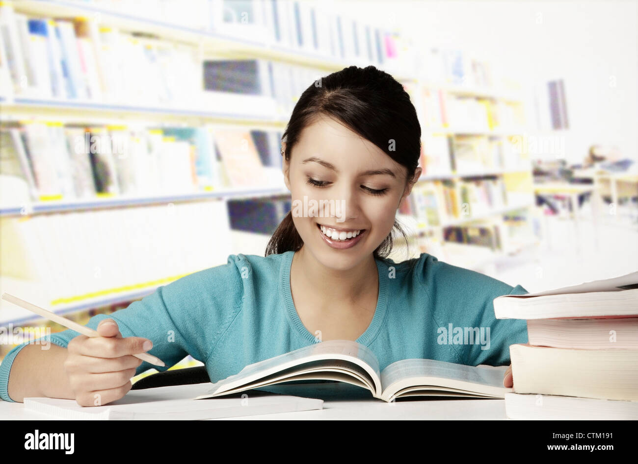 young girl happily doing her work Stock Photo - Alamy