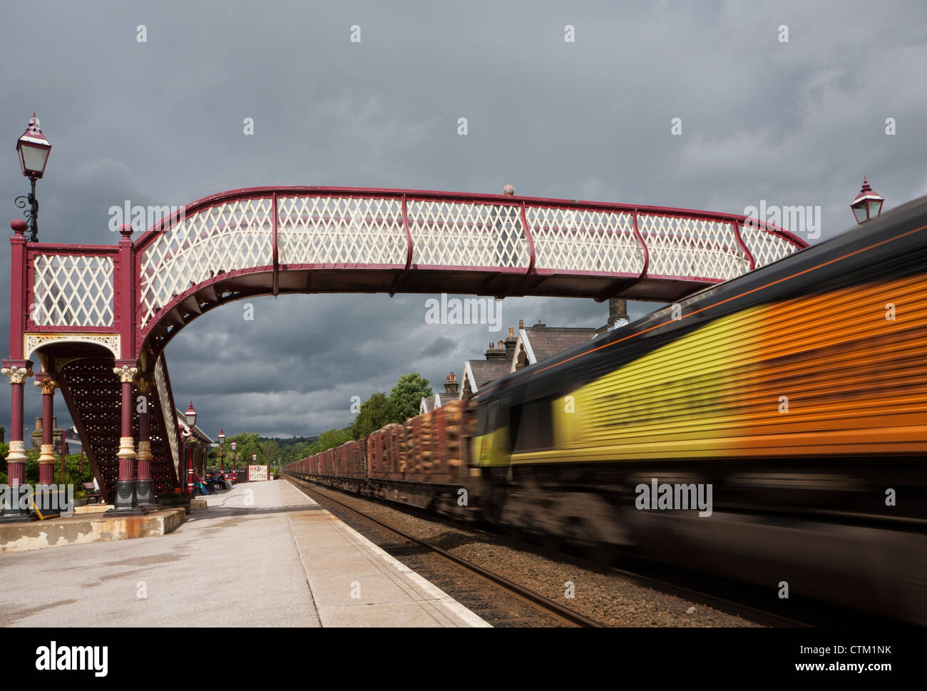 Blurred Colas wood train at Settle Railway Station Stock Photo - Alamy