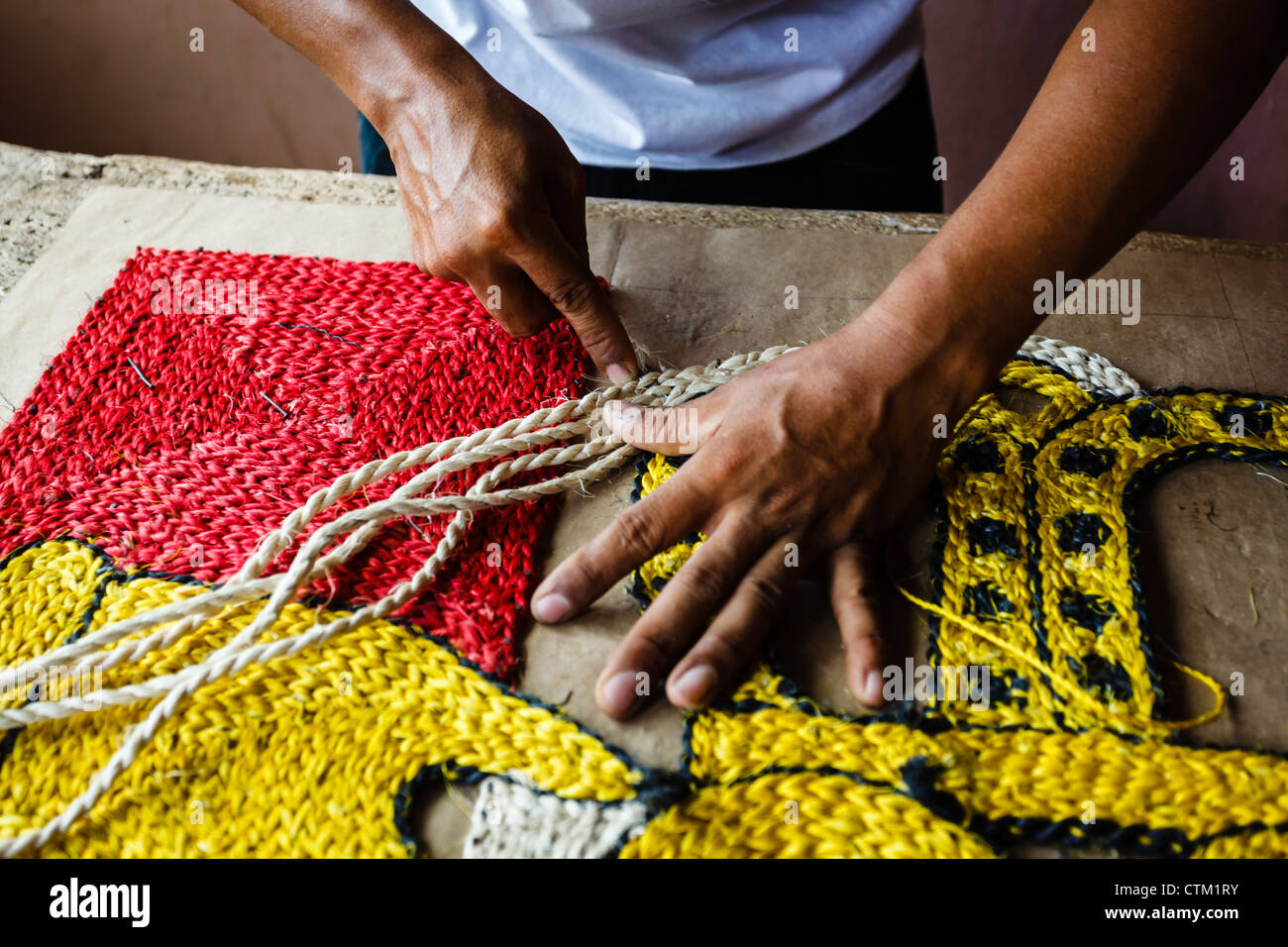 MASAYA, NICARAGUA: Craftsman making a sisal rope tapestry by hand for a ...